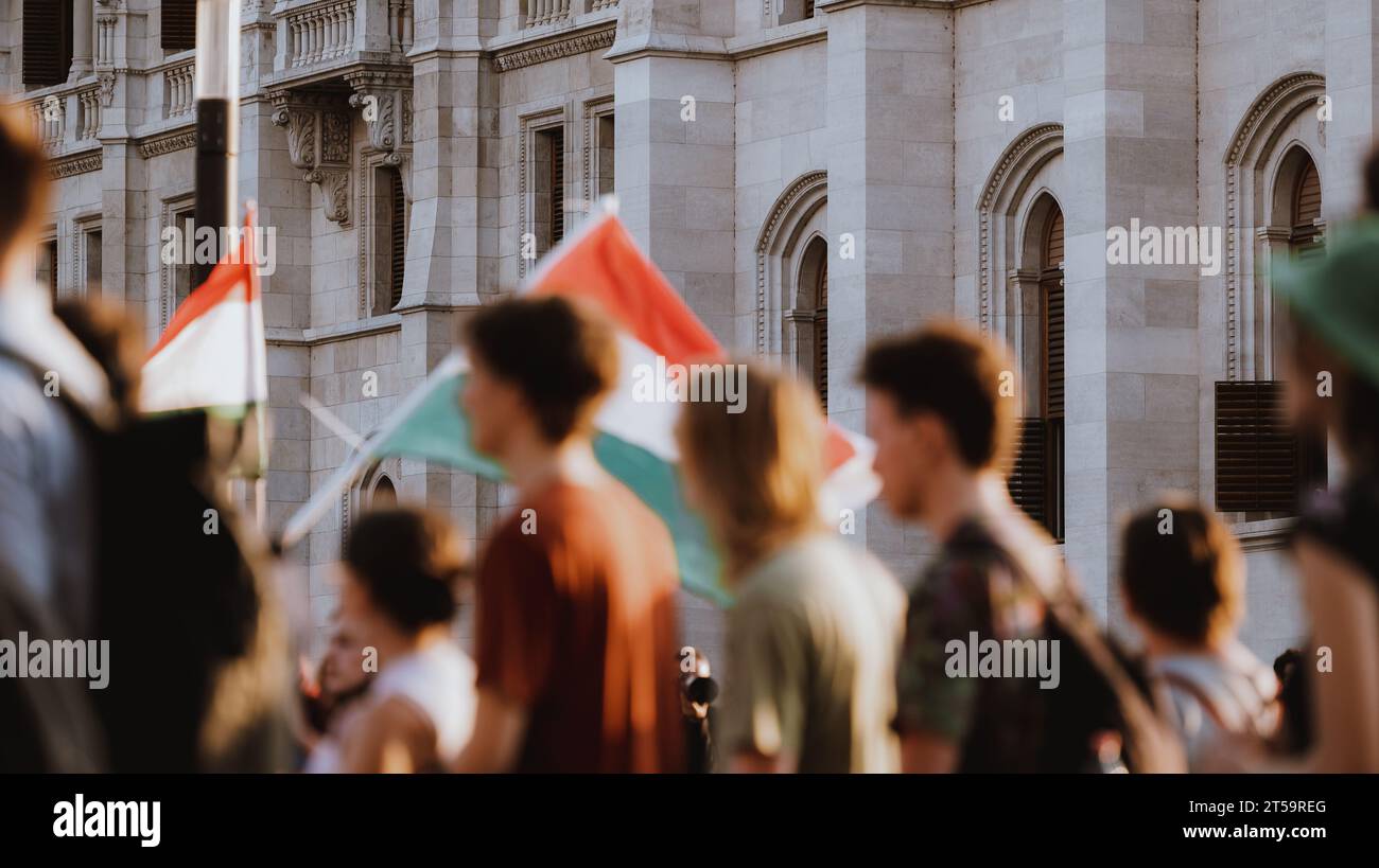 A large crowd of protesters with banners on the streets of Budapest ...