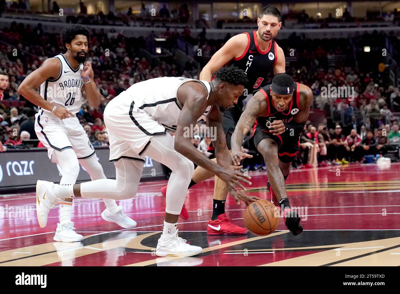 Brooklyn Nets' Dorian Finney-Smith, foreground, and Chicago Bulls' Torrey Craig, right, reach ...