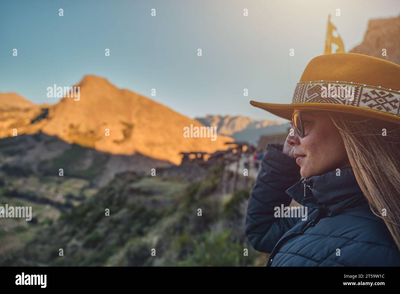 traveler hipster girl in hat with backpack exploring Pisac ...
