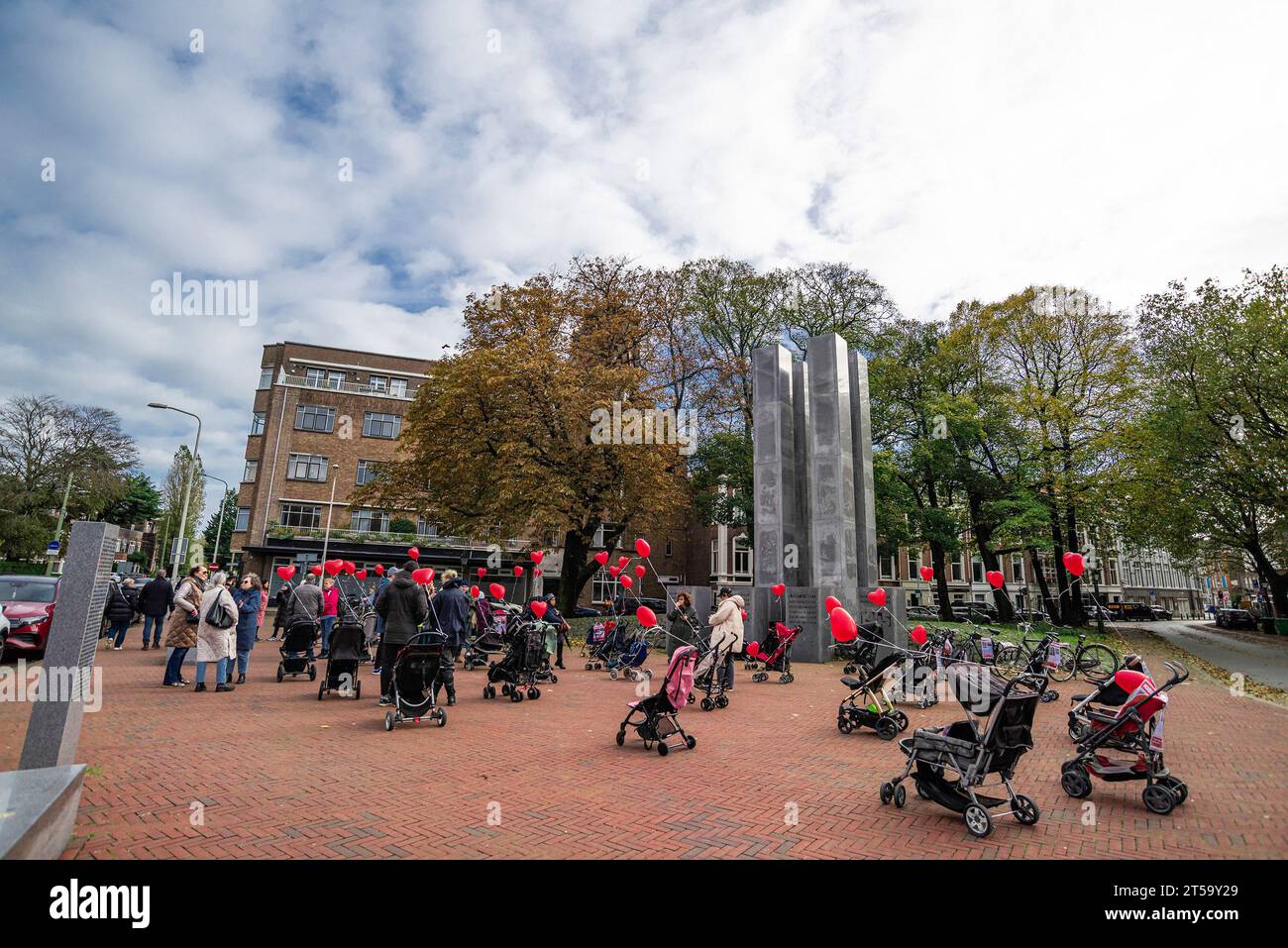 Israeli and non-Israelis with red-helium balloons attached to prams and ...