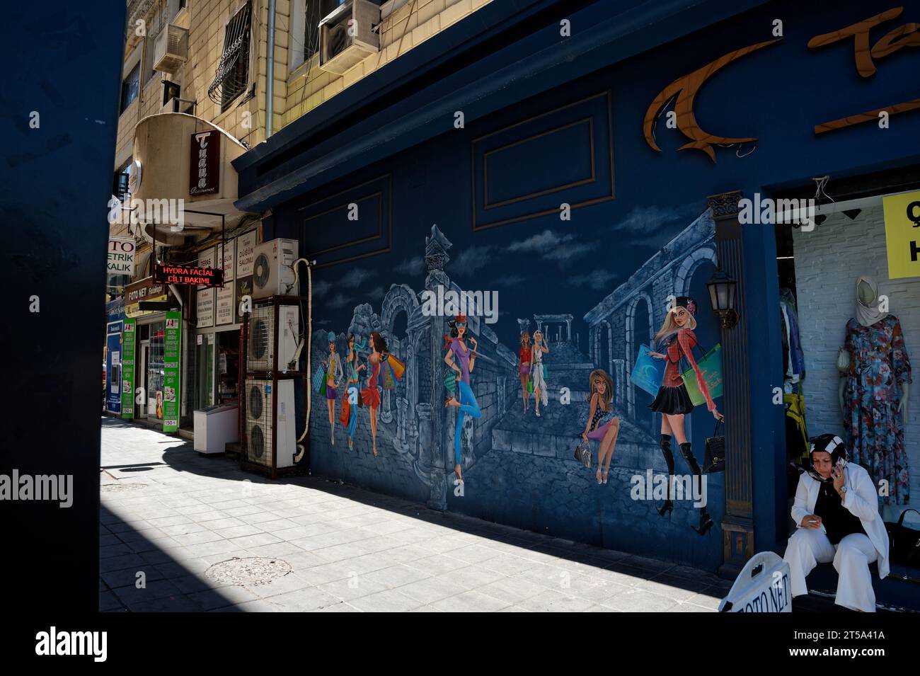 Vibrant street art mural adorning the rear facade of a trendy apparel ...