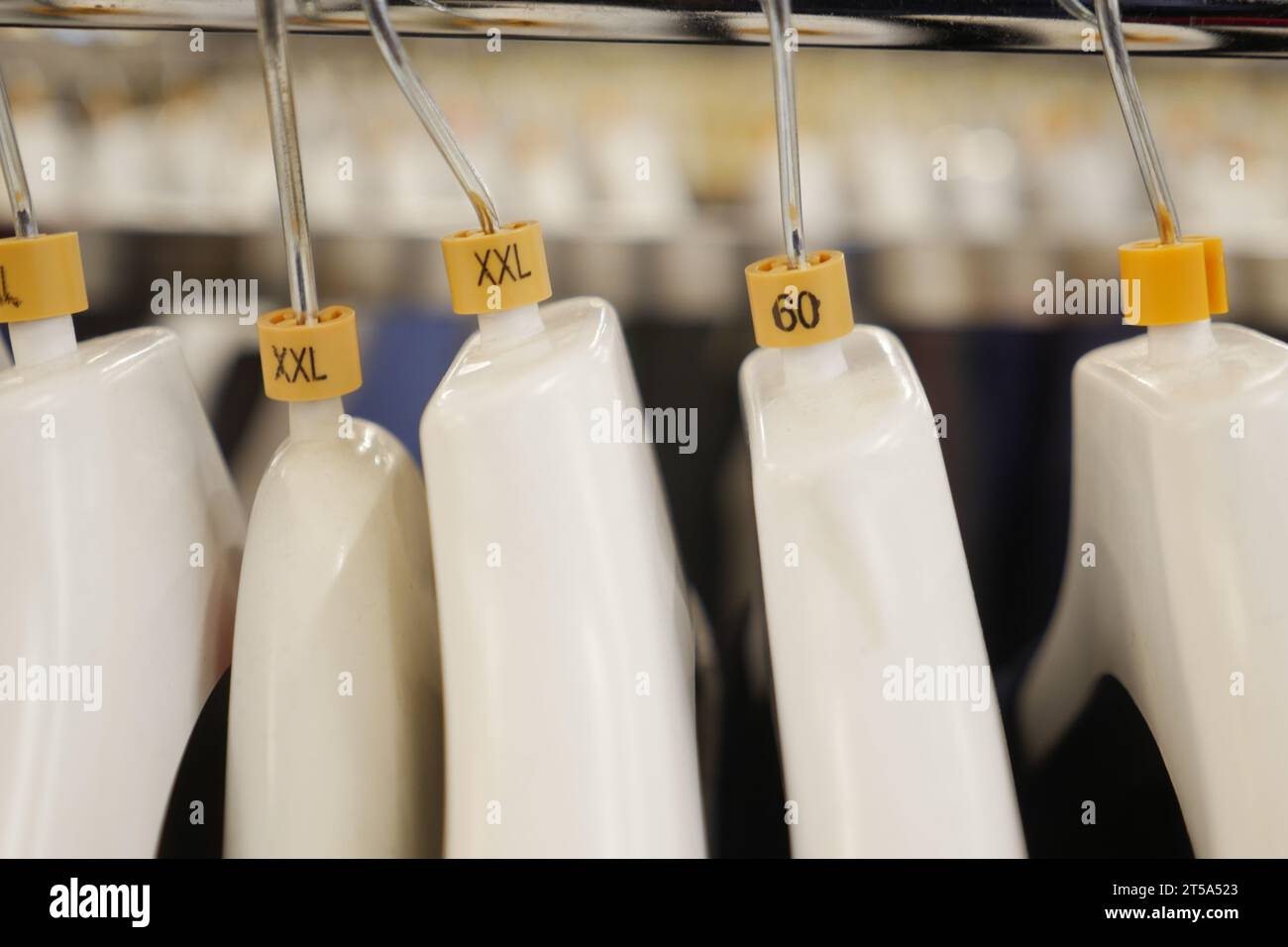 Size marker on the hanger Stock Photo - Alamy