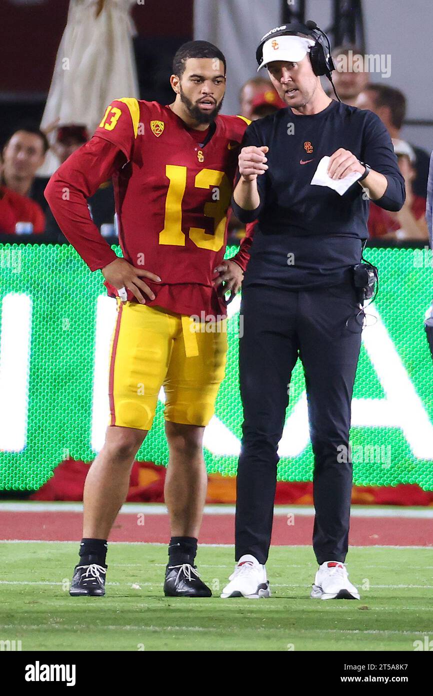USC Trojans head coach Lincoln Riley confers with quarterback Caleb ...