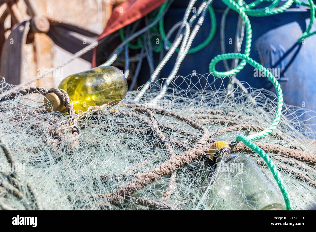 Fishing equipment lies in a jumble in the harbour in Valparaiso, Chile ...