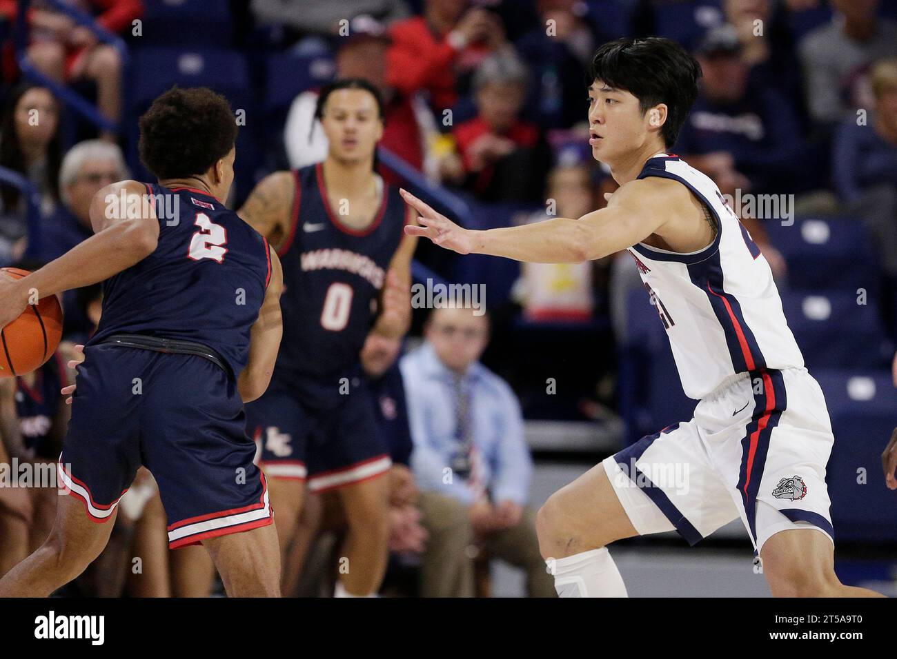 Gonzaga forward Jun Seok Yeo, right, defends Lewis-Clark State guard ...
