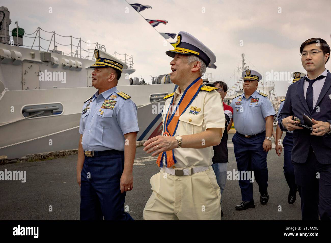 Japan Coast Guard Commandant Admiral Shohei Ishii, right, and ...