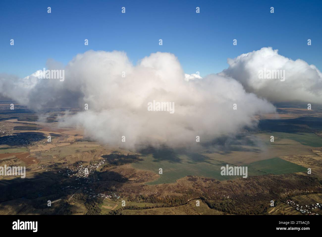 Aerial view from airplane window at high altitude of earth covered with ...