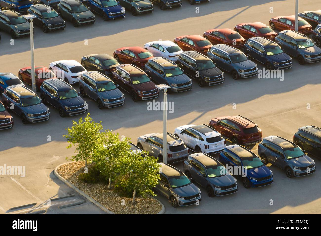 Aerial view of dealership parking lot with many brand new cars for sale ...