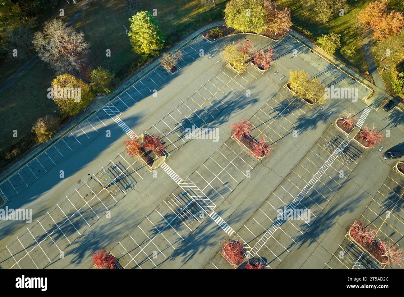 Aerial view of large parking lot with many parked colorful cars ...