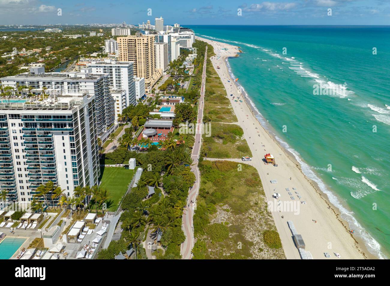 Aerial view of South Beach sandy surface with tourists relaxing on hot ...