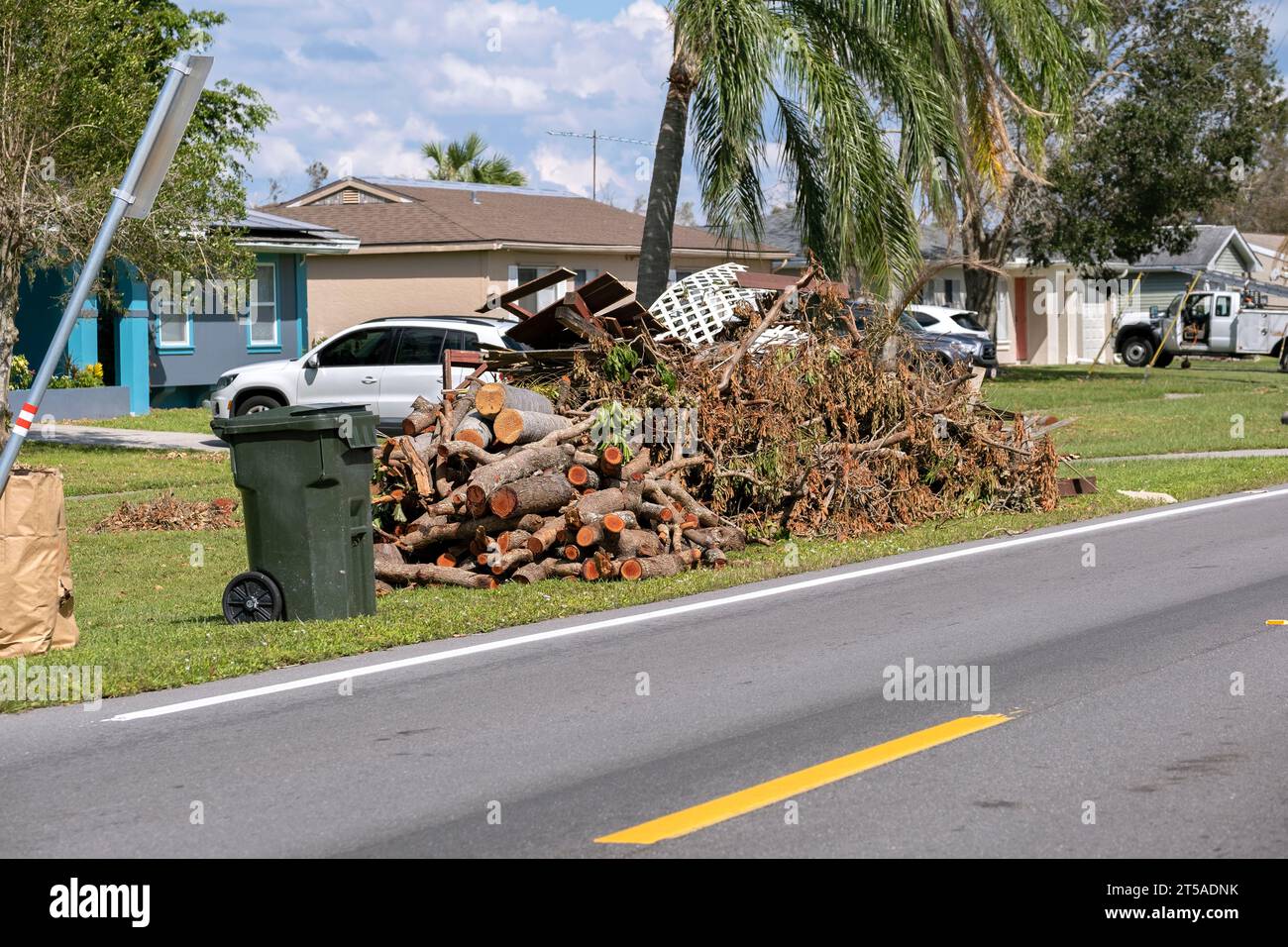 Broken tree limbs and branches on roadside from hurricane wind in ...