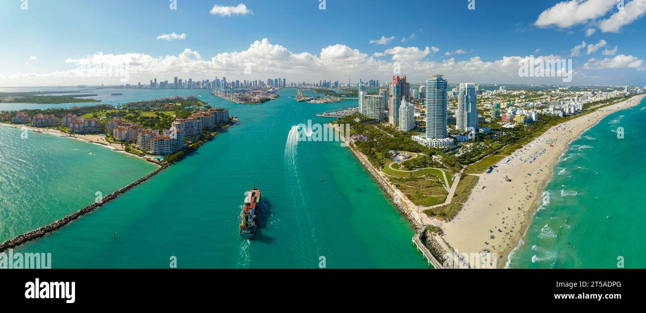 Commercial container ship entering Miami port harbor through main ...