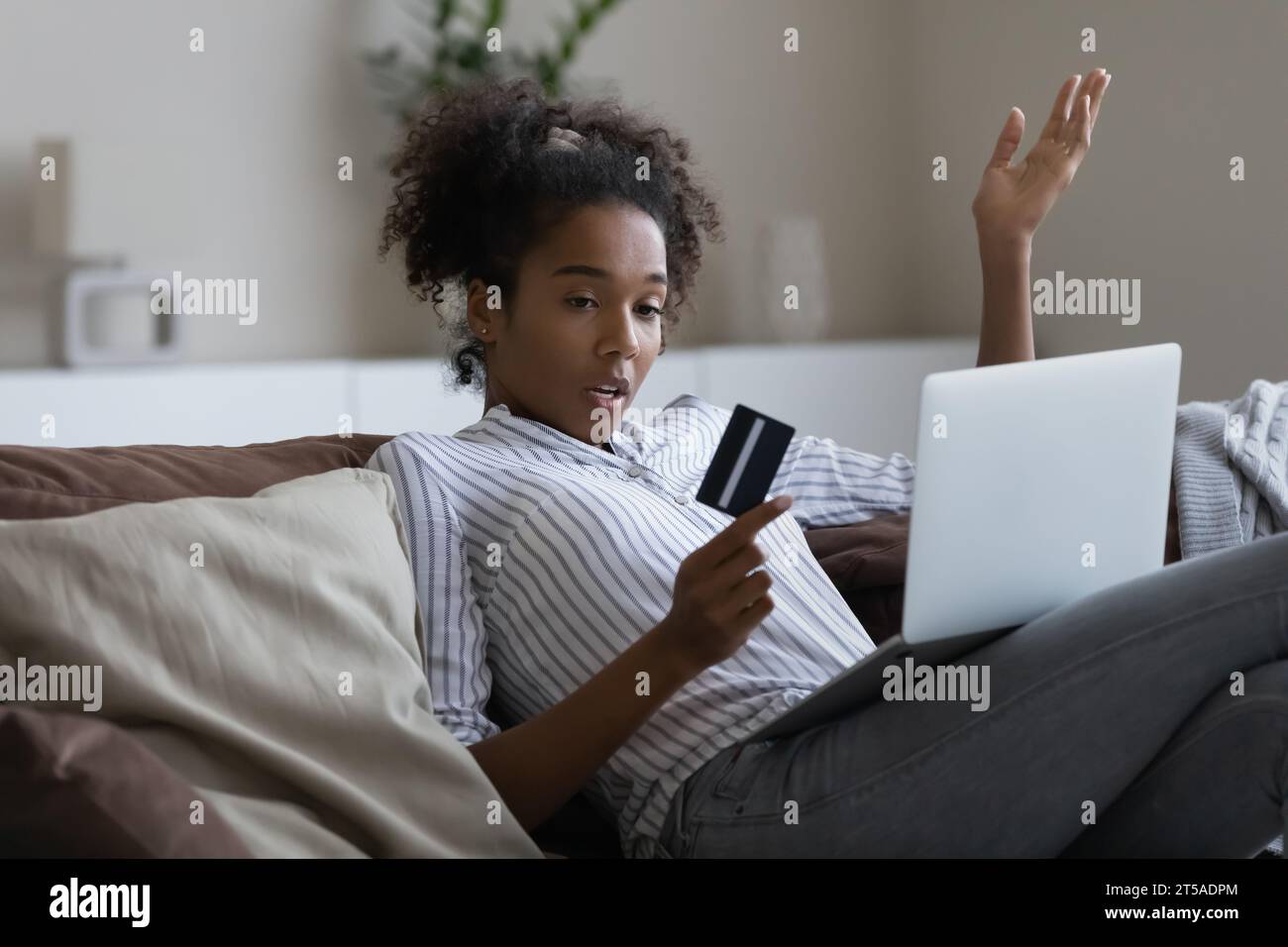 Surprised concerned young Black shopper, internet store customer Stock ...