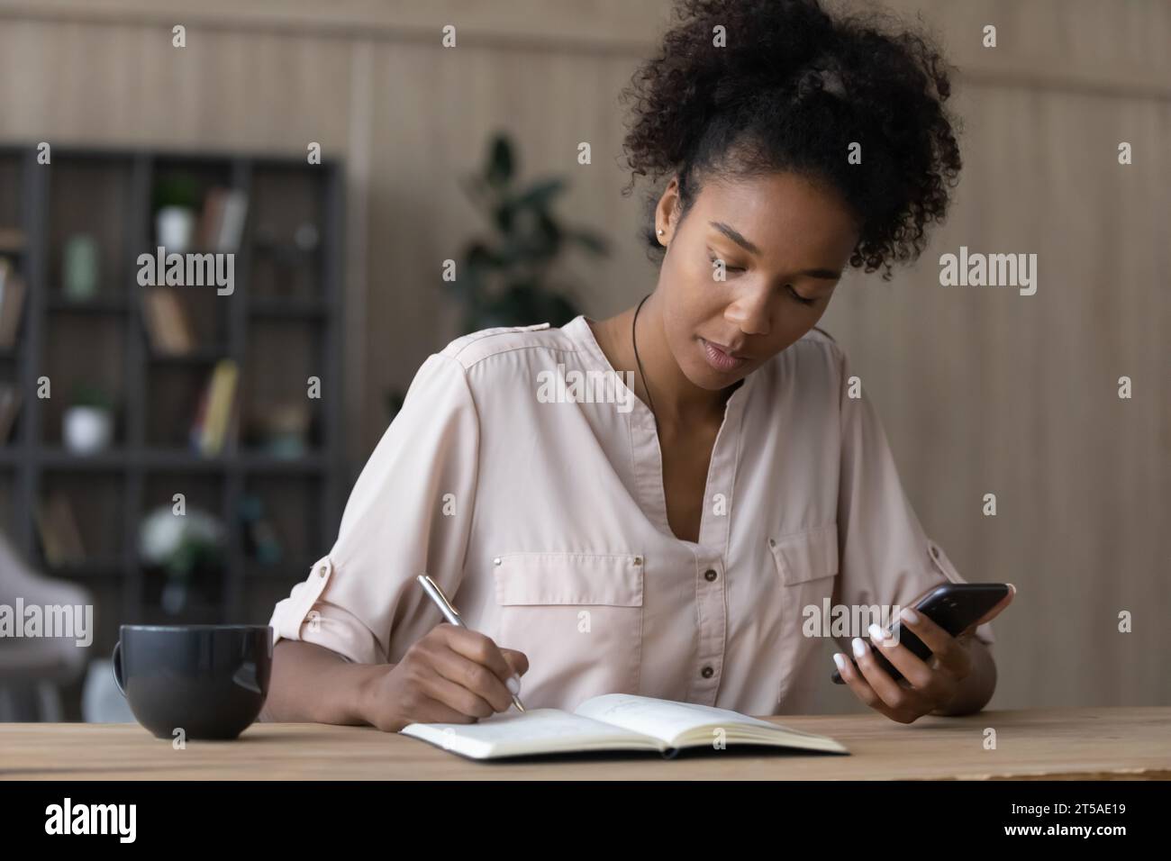 Serious African American millennial student watching learning webinar ...