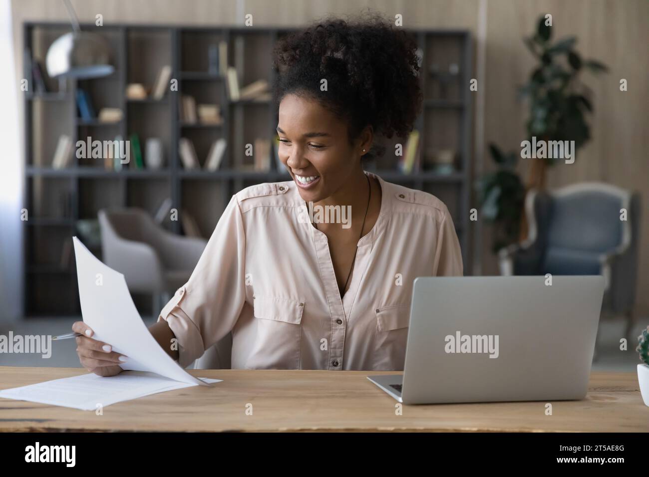 Happy Black student girl receiving letter, acceptance notice from ...