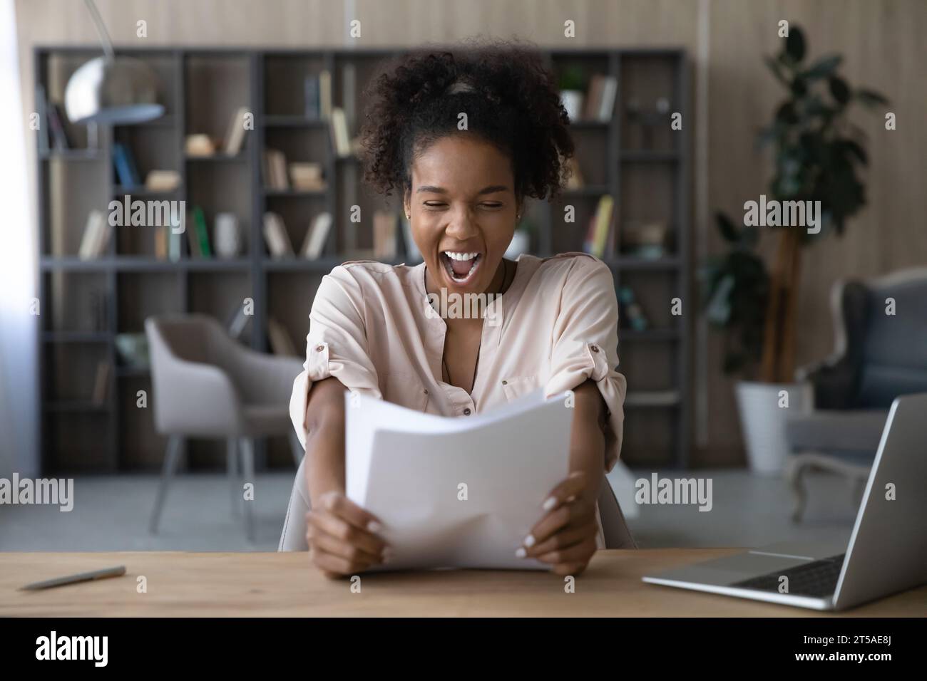 Happy excited African student girl receiving admission letter from ...
