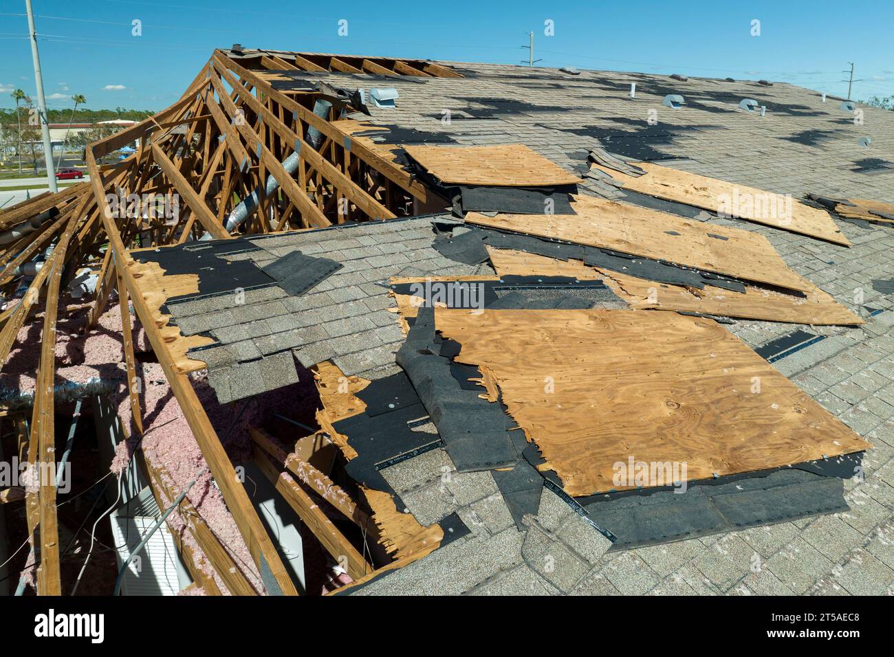 Hurricane Ian destroyed house roof in Florida residential area. Natural ...