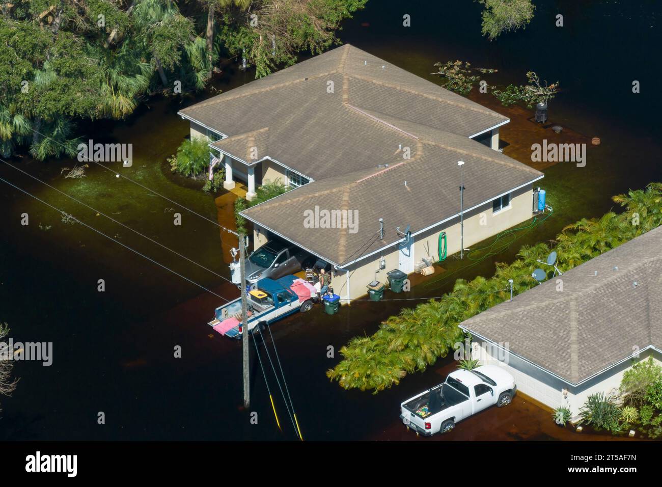 Surrounded by hurricane rainfall flood waters homes in Florida ...
