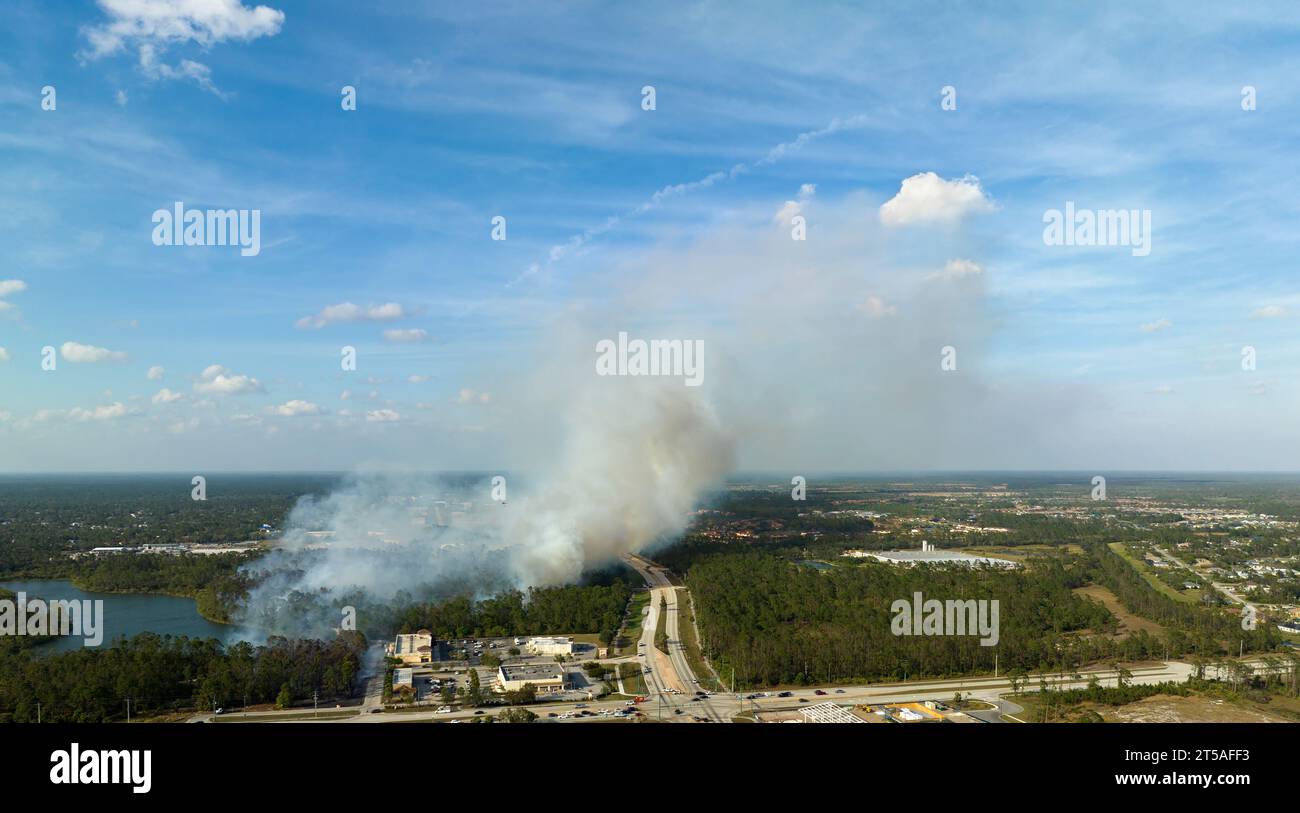 View from above of lagre wildfire burning severely in North Port city ...