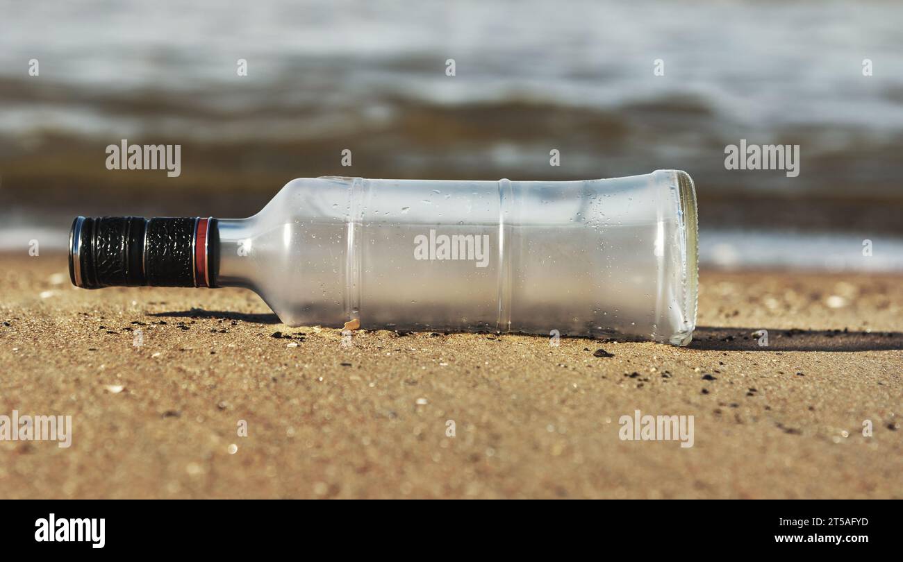 Empty bottle alcohol on beach hi-res stock photography and images - Alamy
