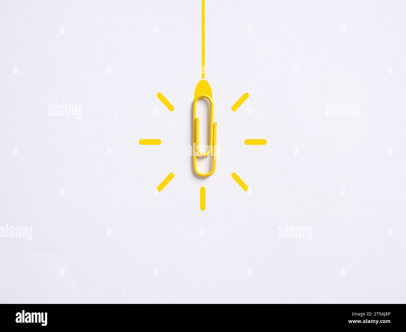 Light bulb made from yellow paper clip on white background. Creativity ...