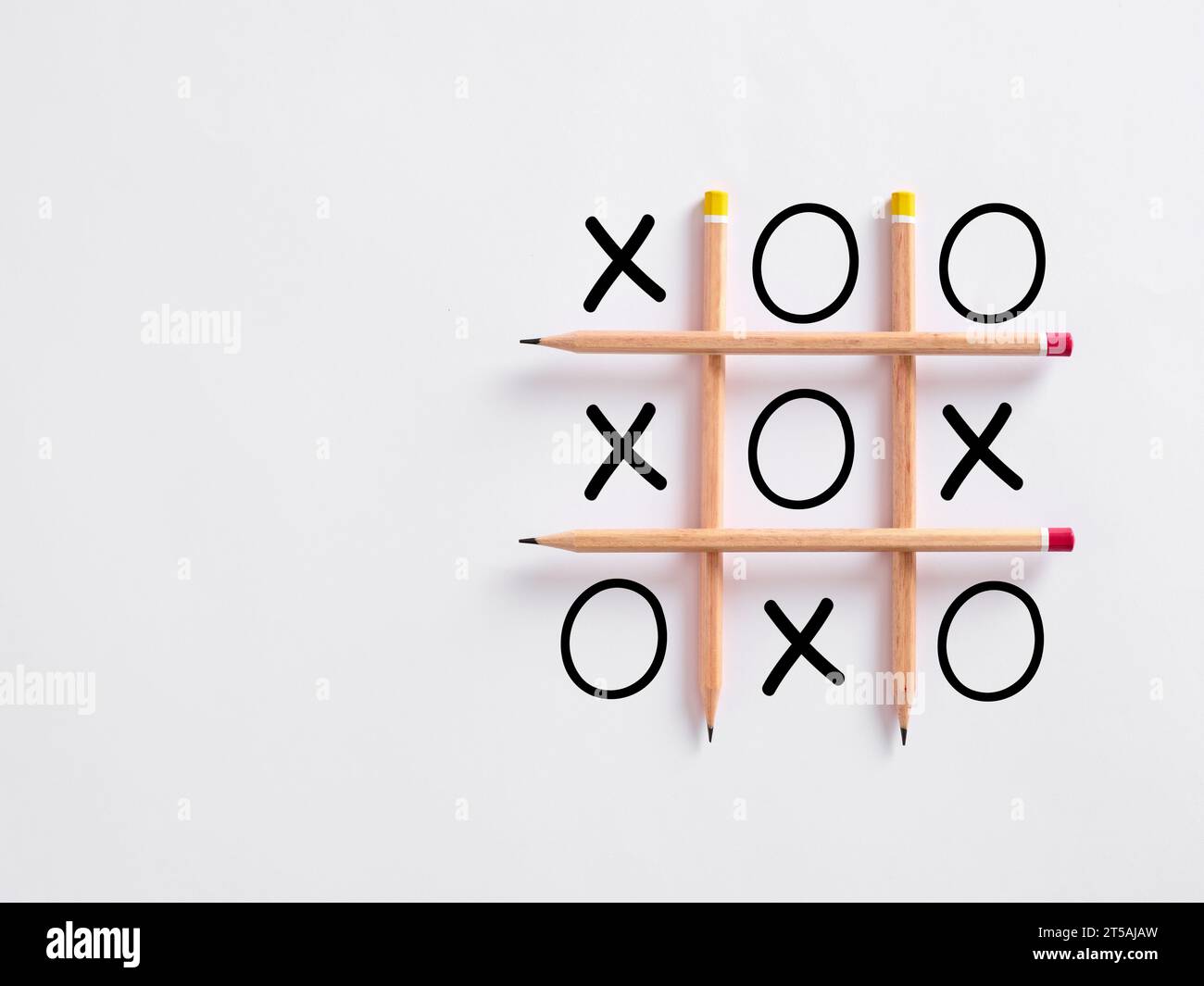 Tic tac toe strategy game with pencils used as lines Stock Photo - Alamy