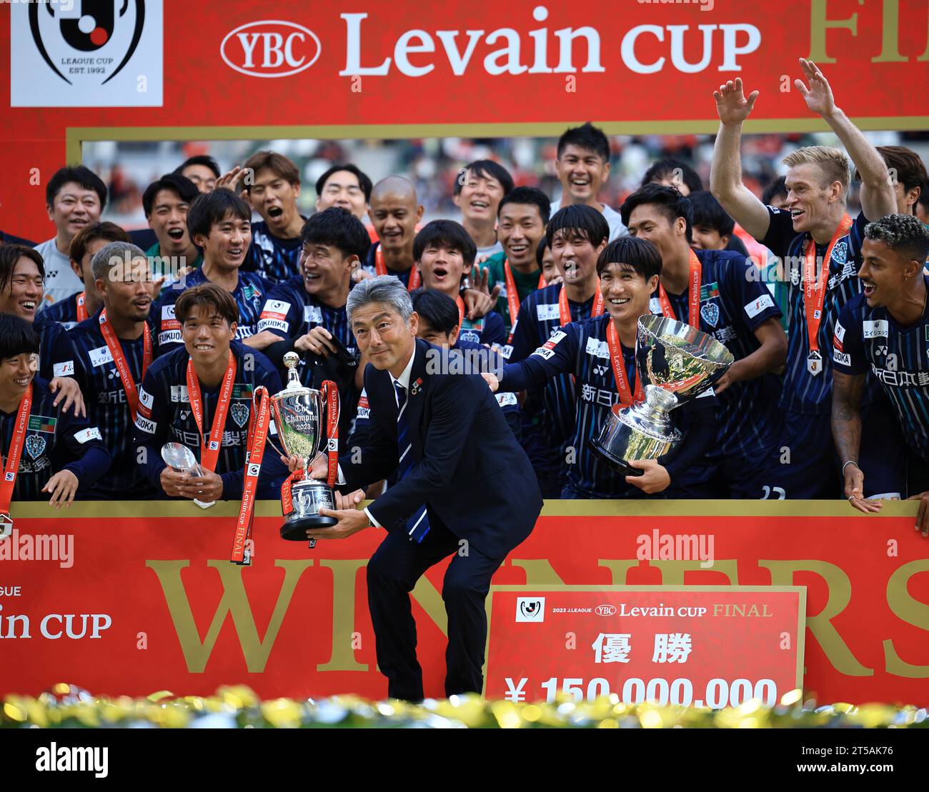 Manager of Avispa Fukuoka Shigetoshi Hasebe holds the trophy of the J.LEAGUE YBC LEVAIN CUP ...
