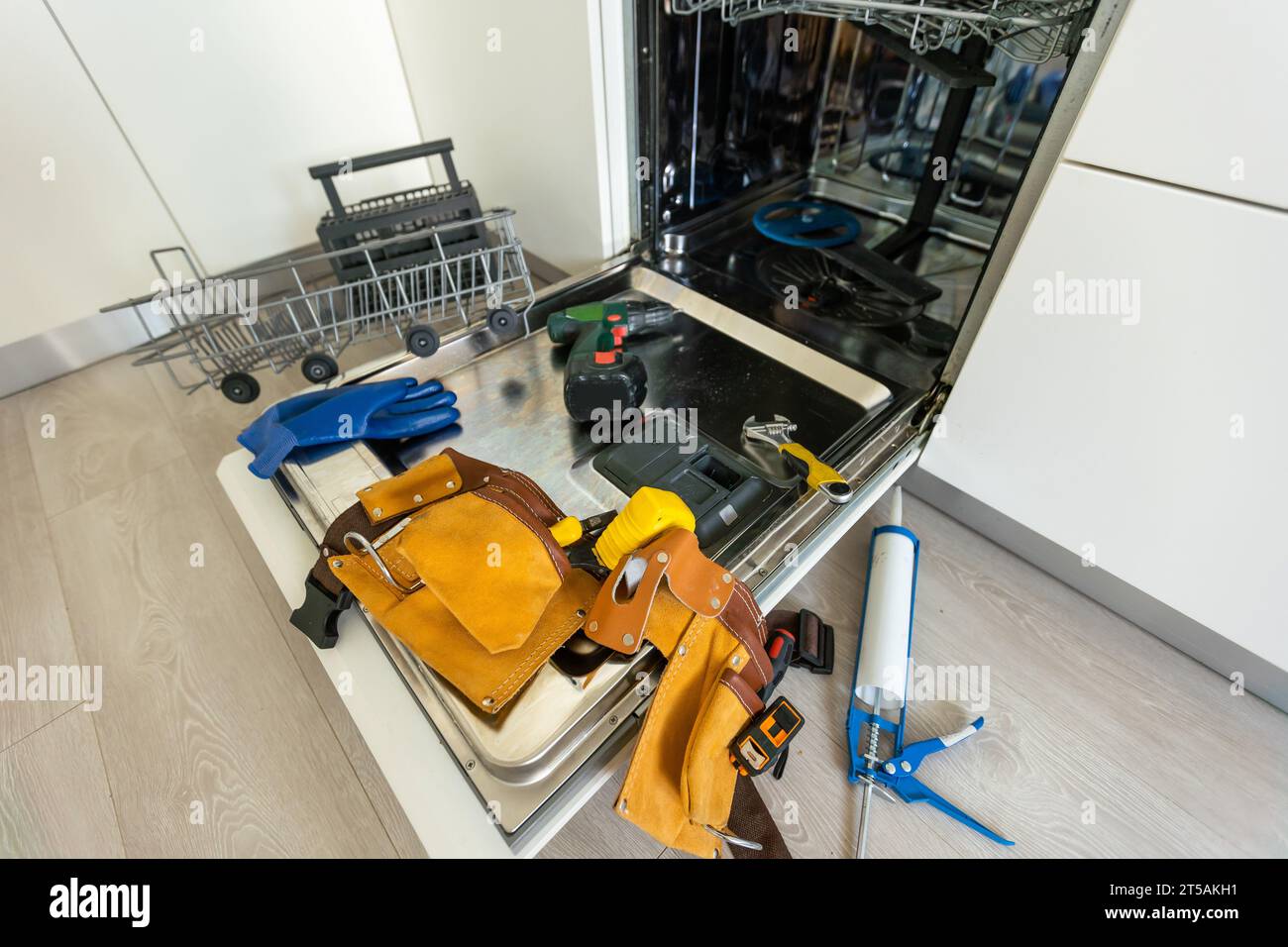 repairing a dishwasher with tools Stock Photo - Alamy
