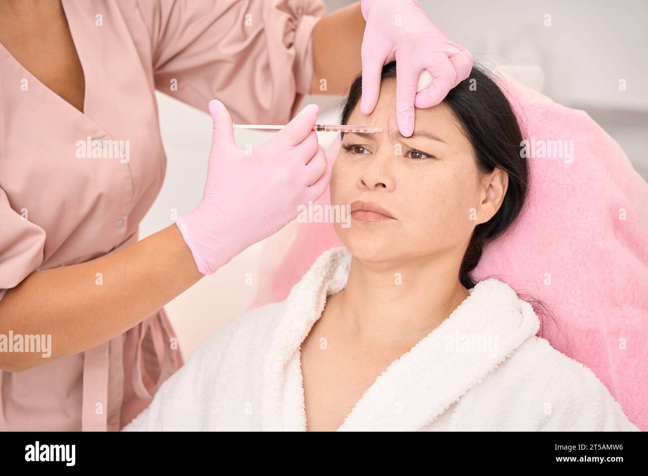 Modern injection rejuvenation procedure in a cosmetology salon Stock ...