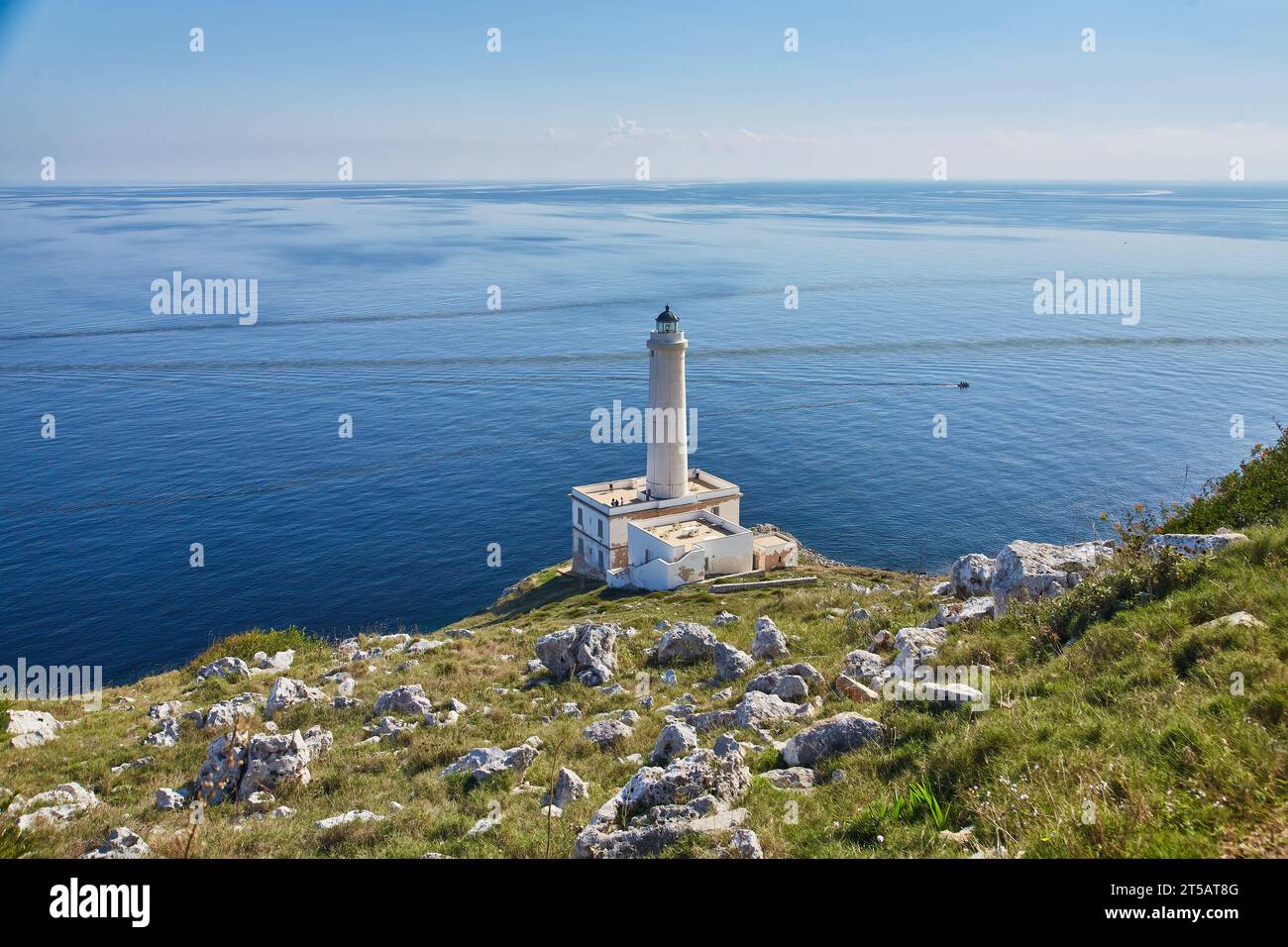 Scenic view of cliff path on the sea Punta Palascia lighthouse on ...