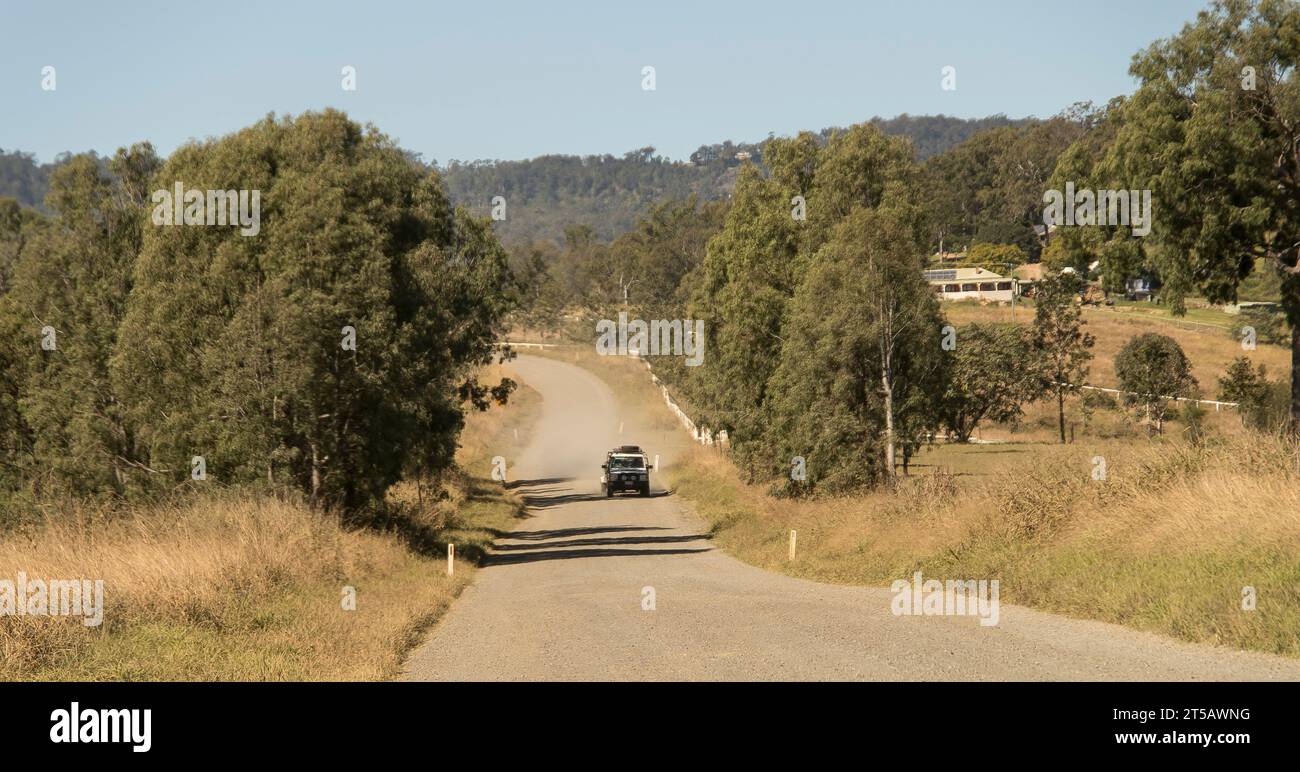 Dusty rural road in winter in SE Queensland, Australia. Trees and dry ...