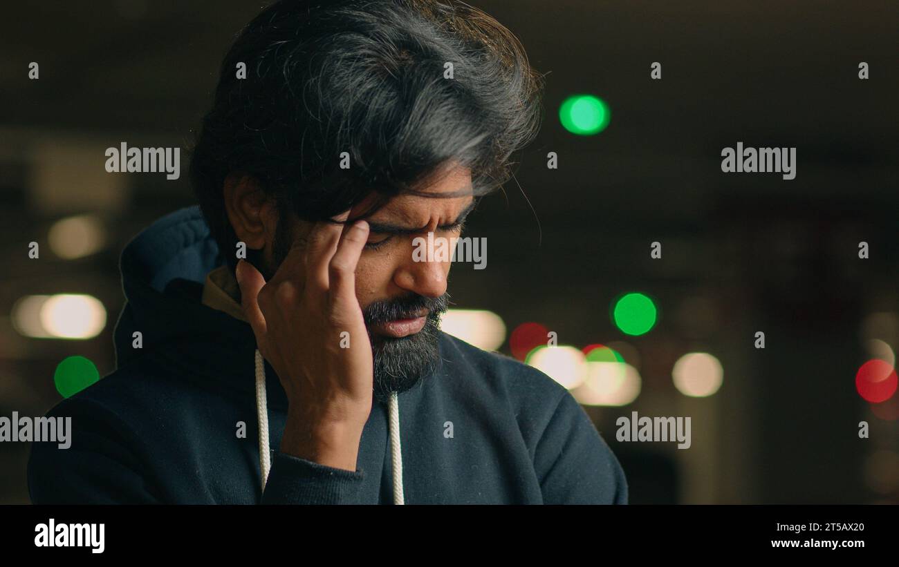 Close up stressed ill worried bad feeling unwell bearded Indian man ...