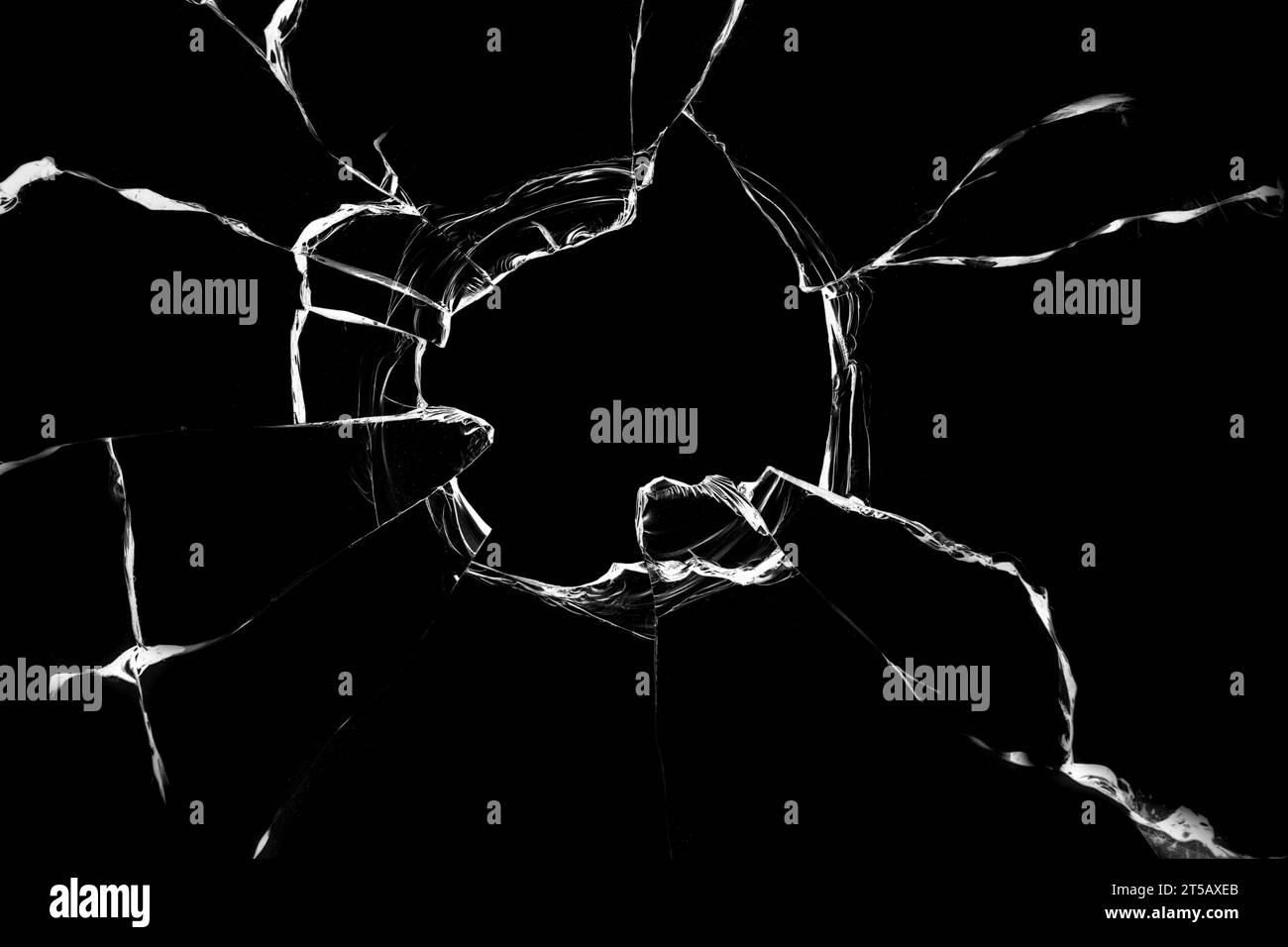 Broken glass from a bullet. Texture of broken glass Stock Photo - Alamy