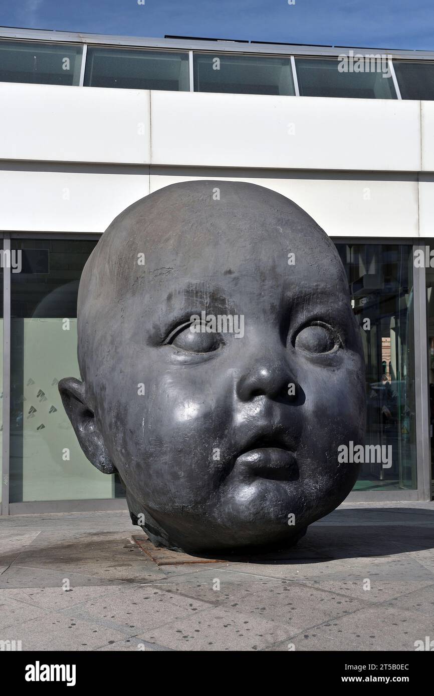 giant baby head;puerta de atocha;atocha railway station;madrid;bronze ...