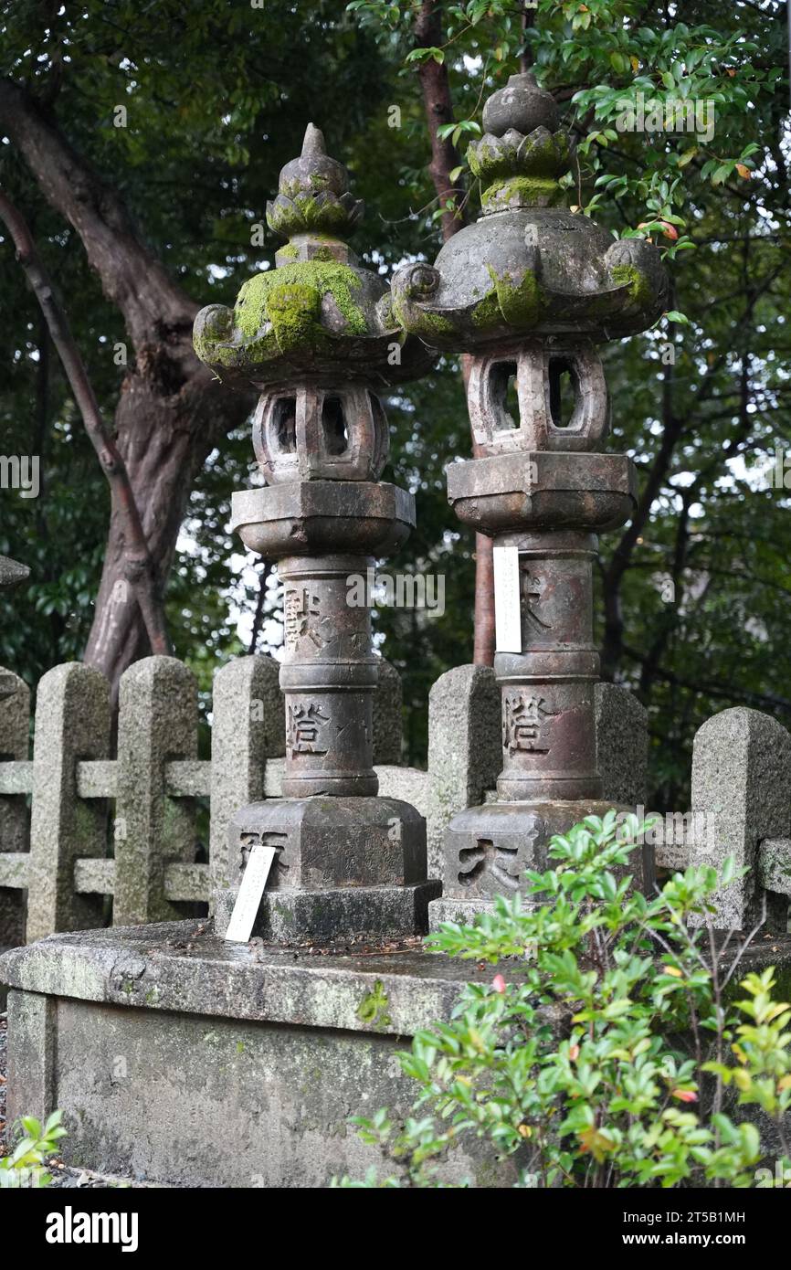 Two stone pillars standing in the middle of an old cemetery Stock Photo ...
