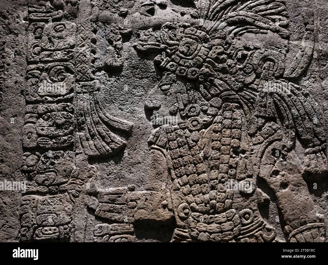 Bas relief carving in a stele tombstone of a mayan ruler king with maya ...