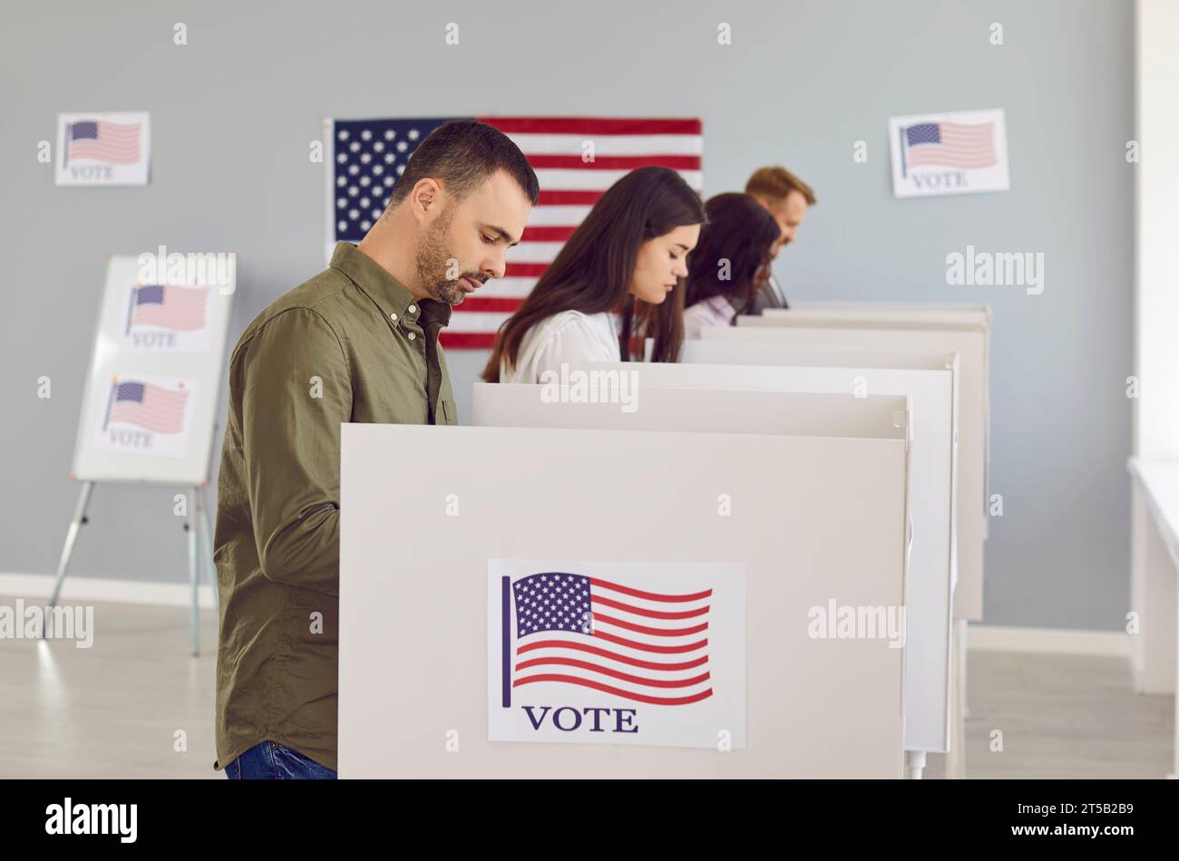 Young man standing booth hi-res stock photography and images - Alamy