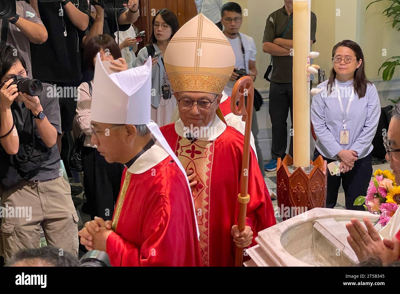 Hong Kong's Bishop and new Cardinal Stephen Chow, center, presides over ...