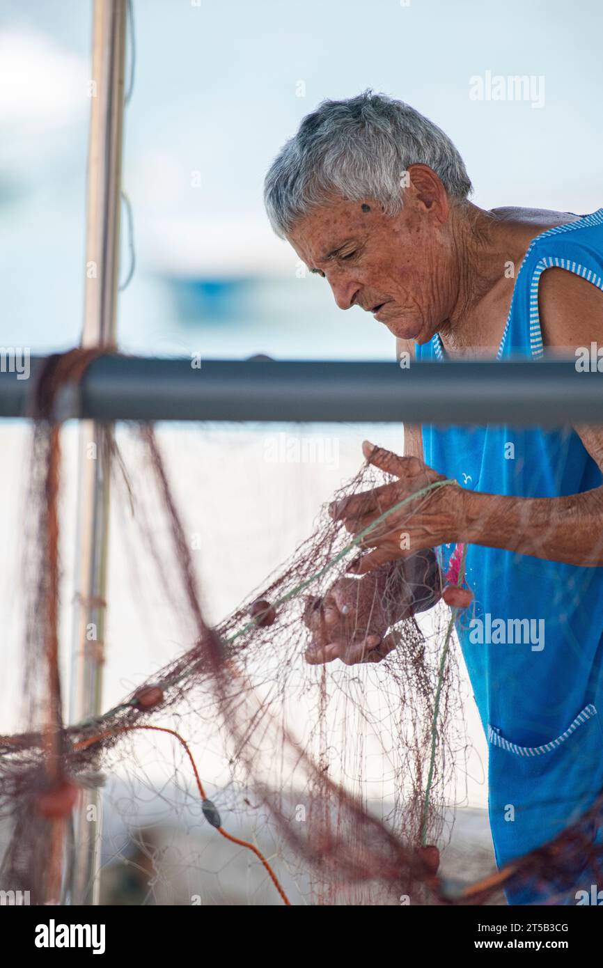 Woman fishing in mediterranean hi-res stock photography and images - Alamy