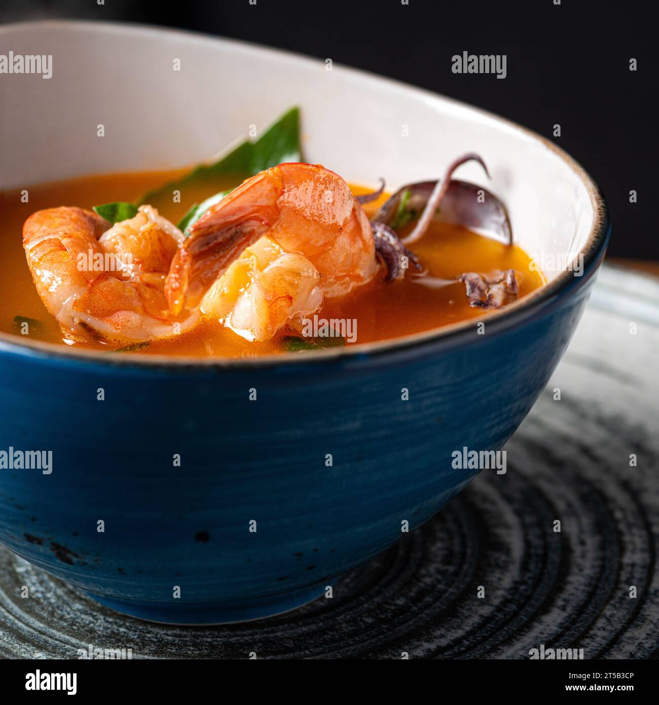 Traditional italian fish soup with shrimp, mussels and salmon. Tom yam ...