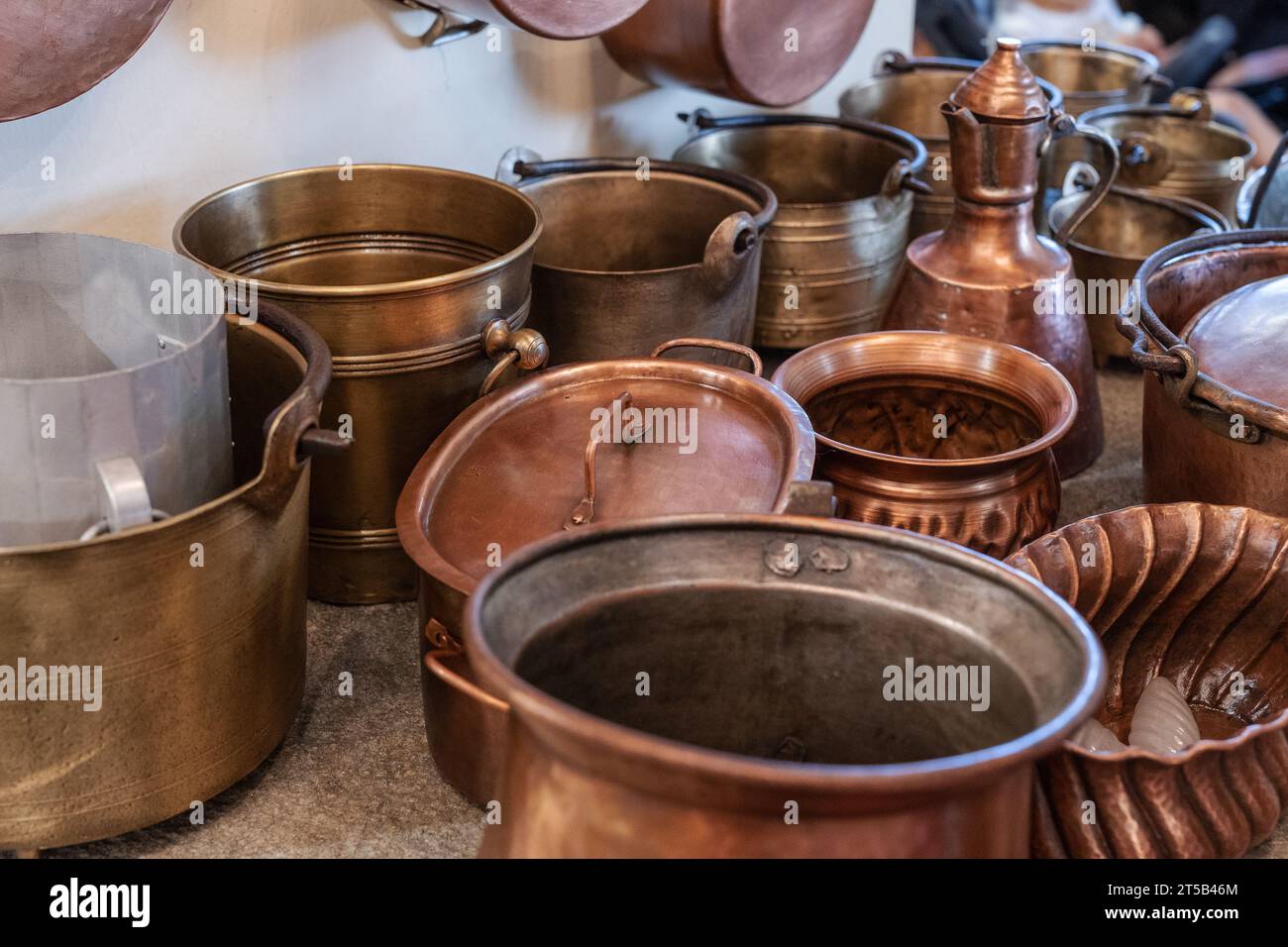Copper Pots and Pans and other Kitchen Utensils in an Antique Kitchen ...