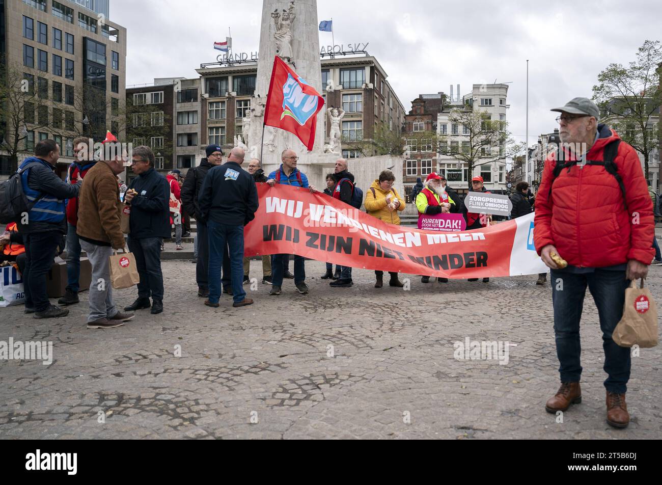 AMSTERDAM - Demonstrators during an action by the trade union FNV ...