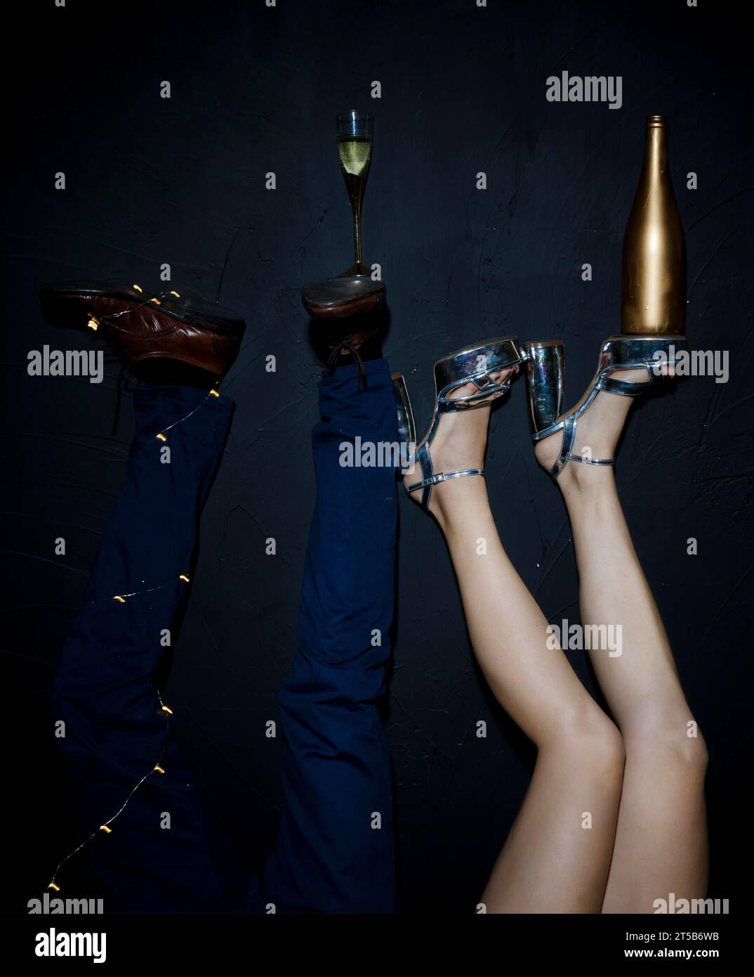 Champagne glass bottle woman man feet Stock Photo - Alamy