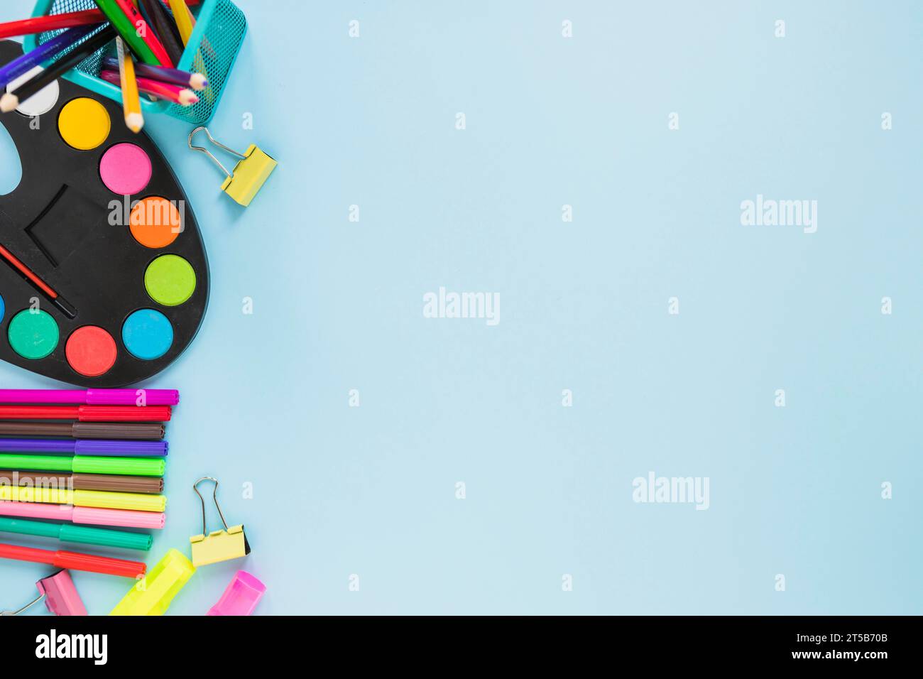 Colorful writing implements laid left side Stock Photo - Alamy
