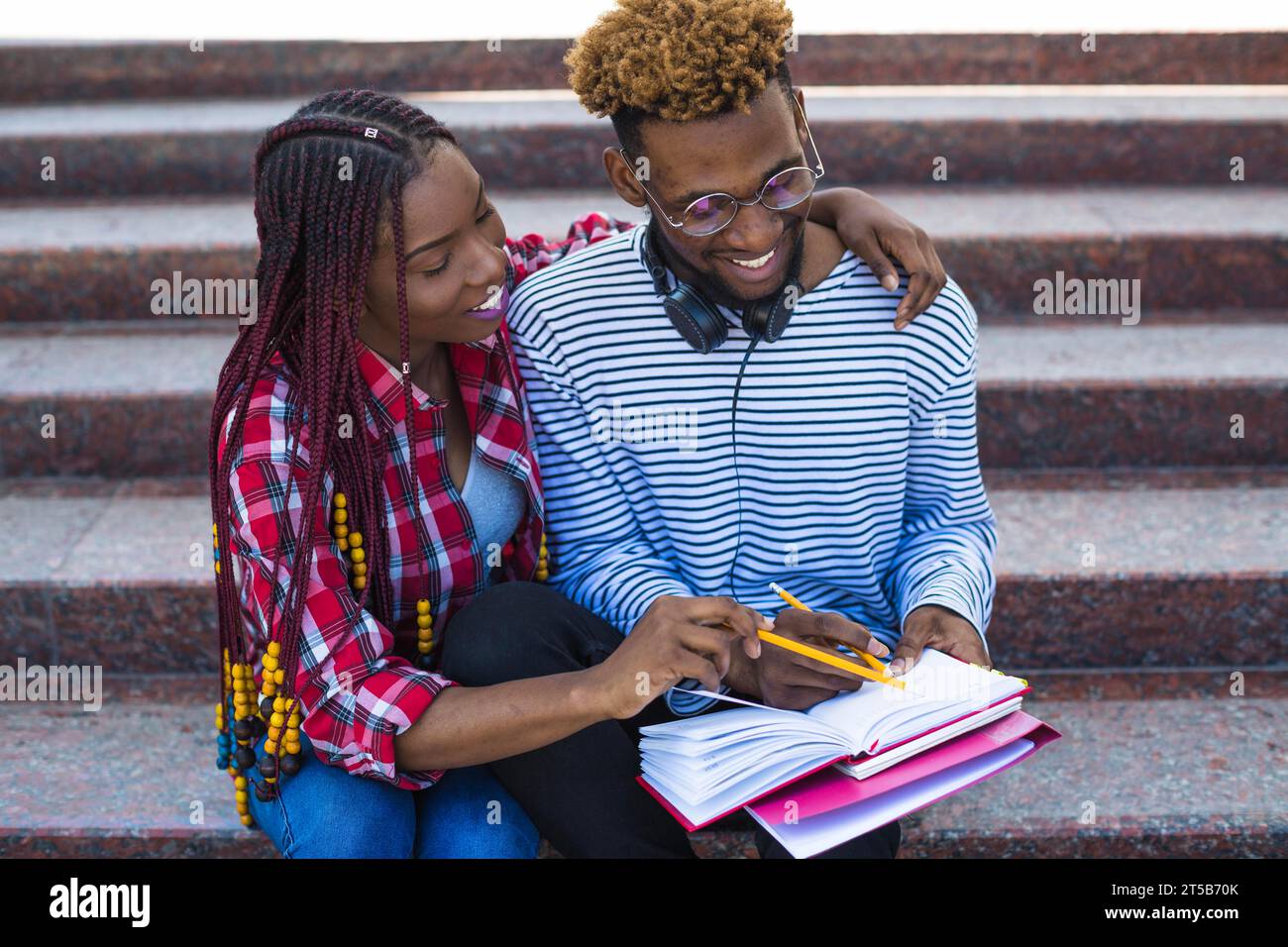 Content students working together Stock Photo - Alamy