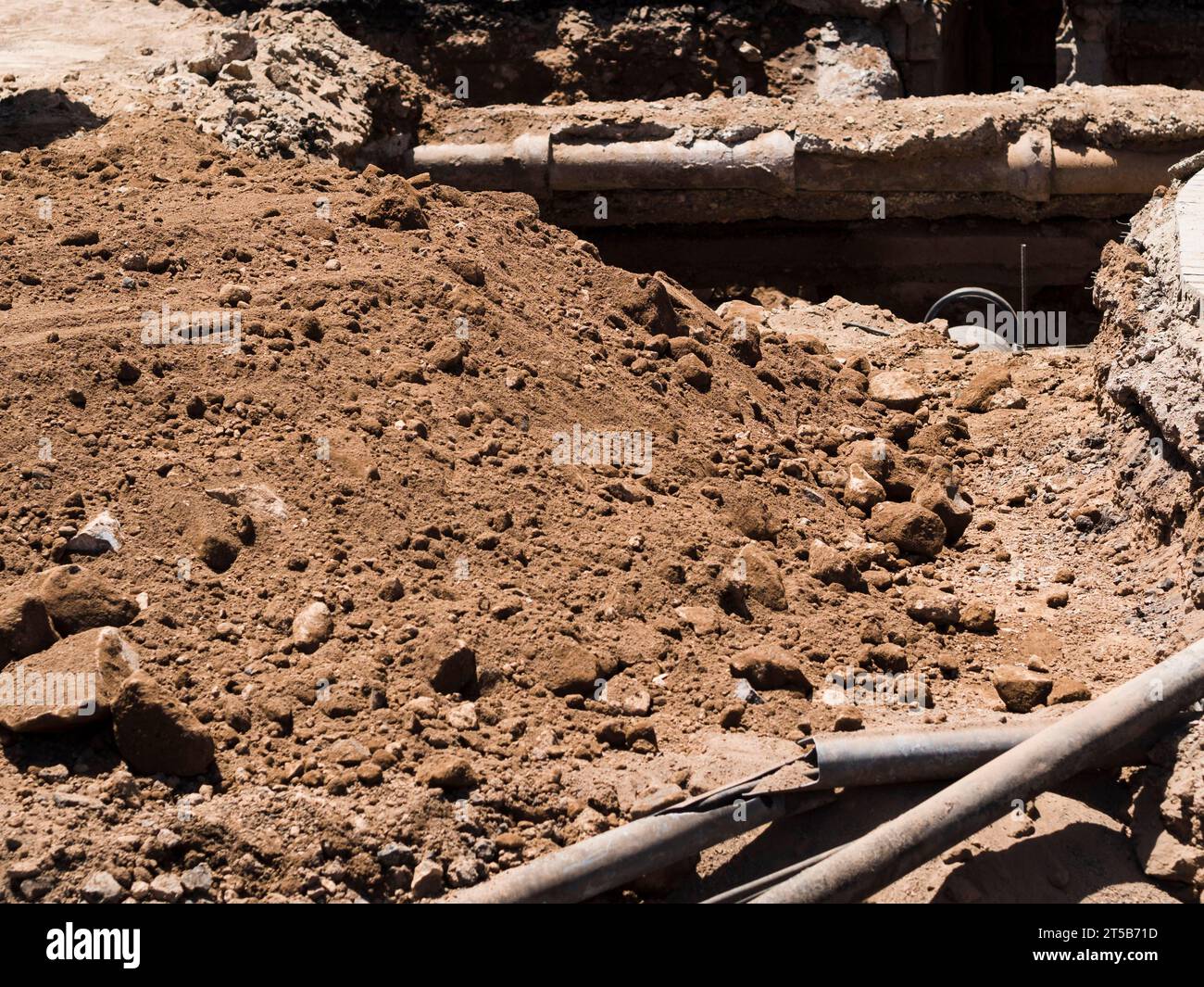 Construction site with old pipes dug out Stock Photo - Alamy