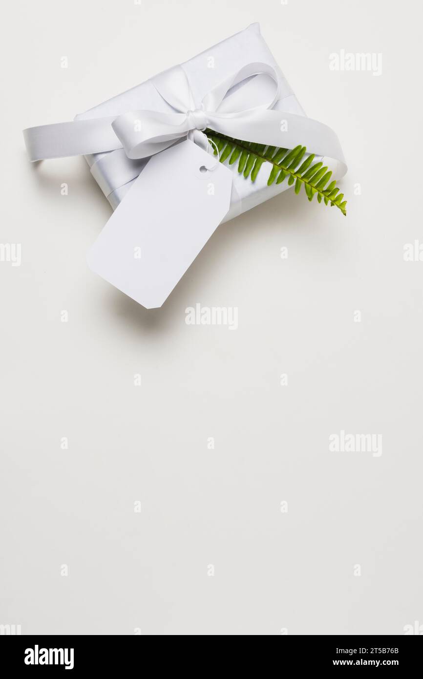 Decorated present white backdrop with empty space Stock Photo - Alamy