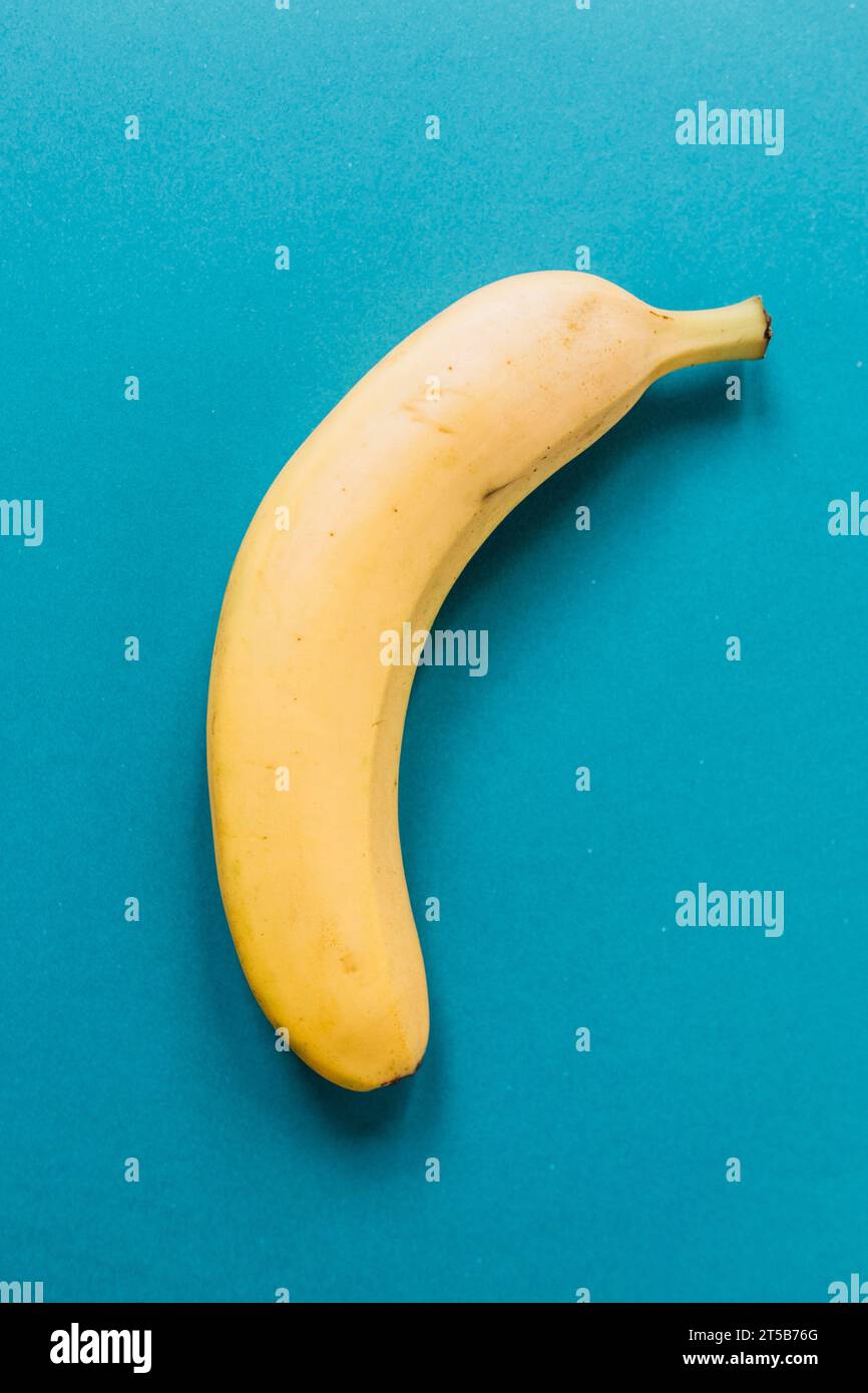 Delicious banana blue background Stock Photo - Alamy