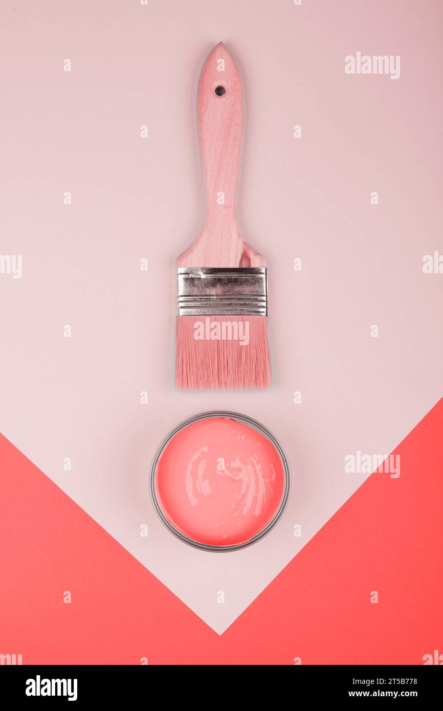 Elevated view paintbrush coral paint geometric paper background Stock ...