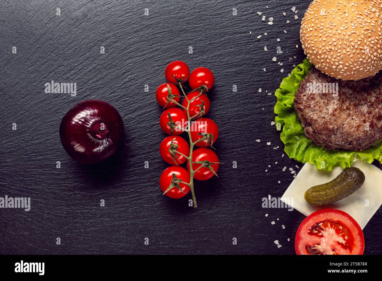 Flat lay burger ingredients slate background Stock Photo - Alamy